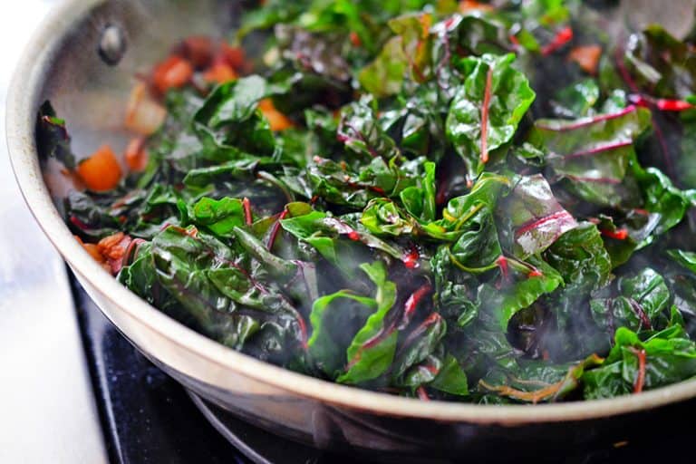 Swiss Chard with Raisins, Pine Nuts, and Crispy Prosciutto - Nom Nom Paleo®