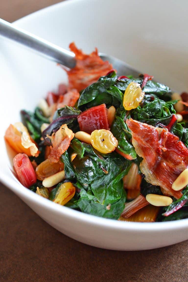 Swiss Chard with Raisins, Pine Nuts, and Crispy Prosciutto - Nom Nom Paleo®